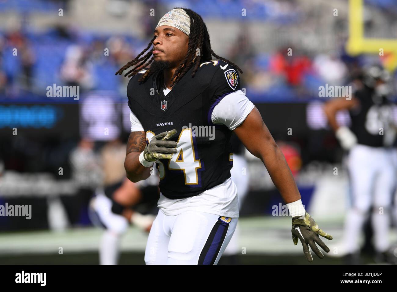 Baltimore Ravens running back Keaton Mitchell (34) warms up before an ...