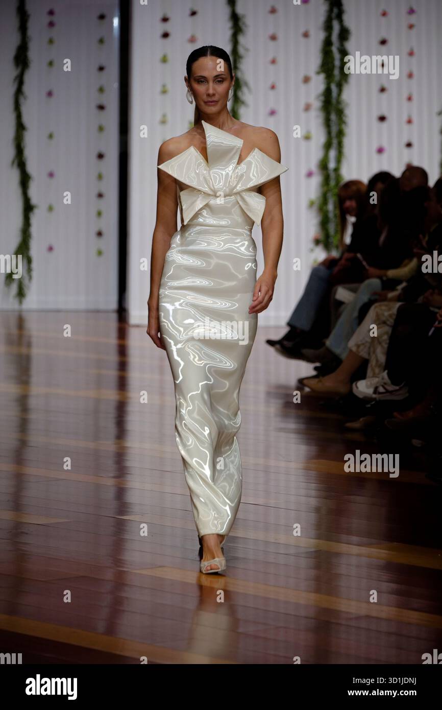 Madrid, Spain. 28th Oct, 2025. A model walks the catwalk during the ...