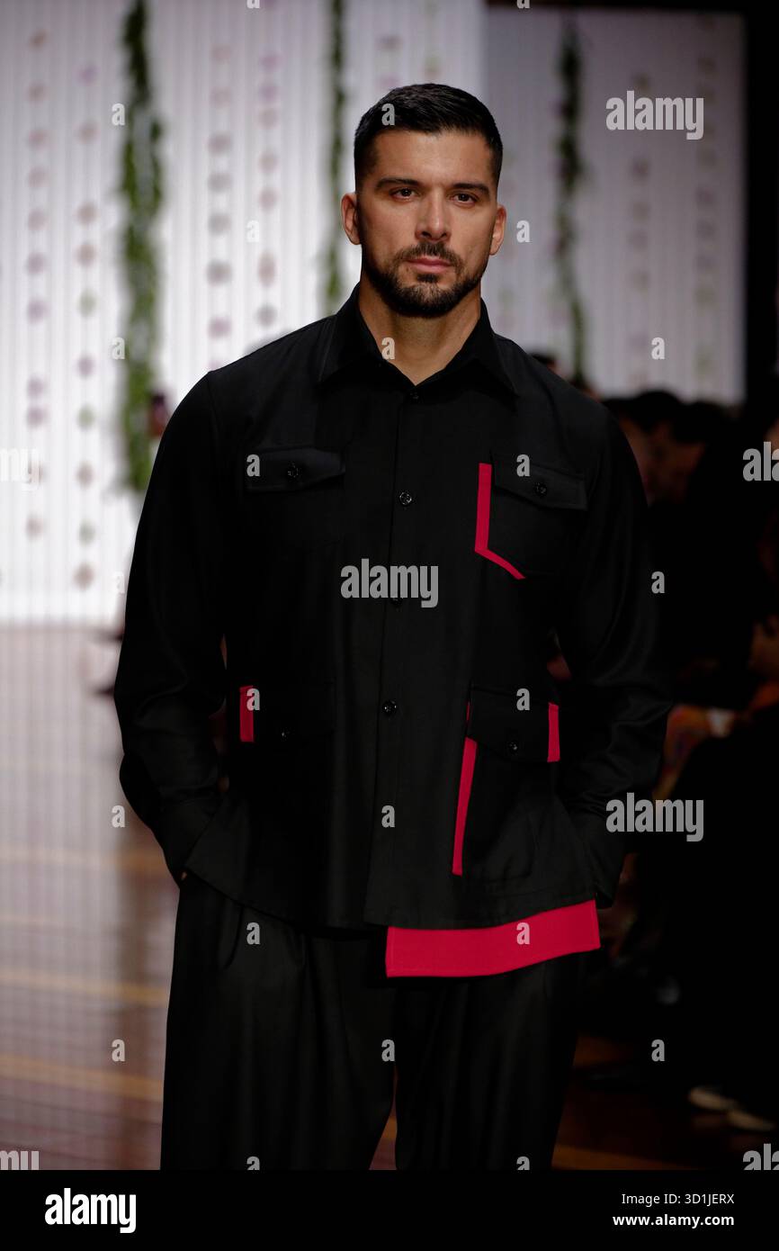 Madrid, Spain. 28th Oct, 2025. A model walks the catwalk during the ...