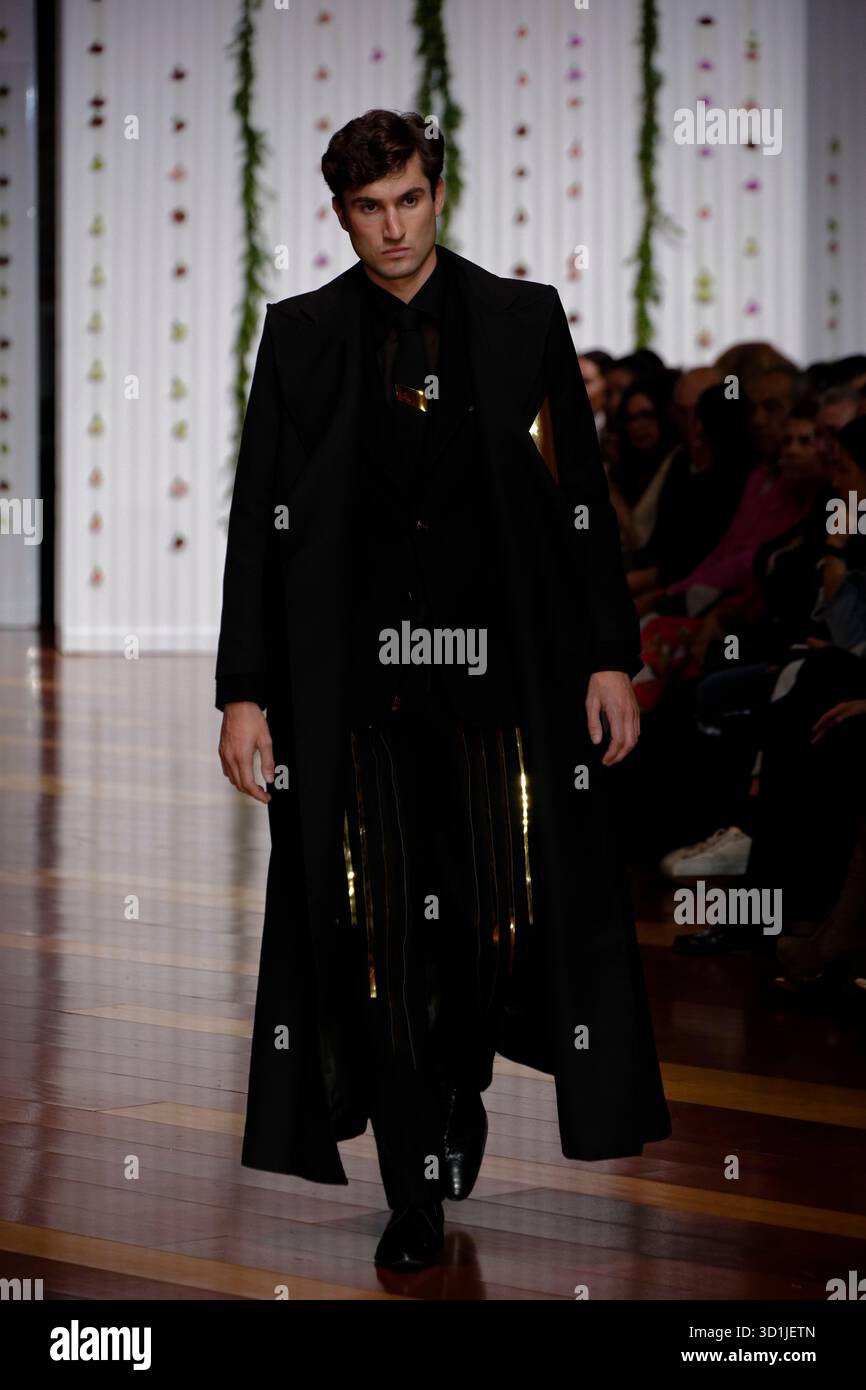 Madrid, Spain. 28th Oct, 2025. A model walks the catwalk during the ...