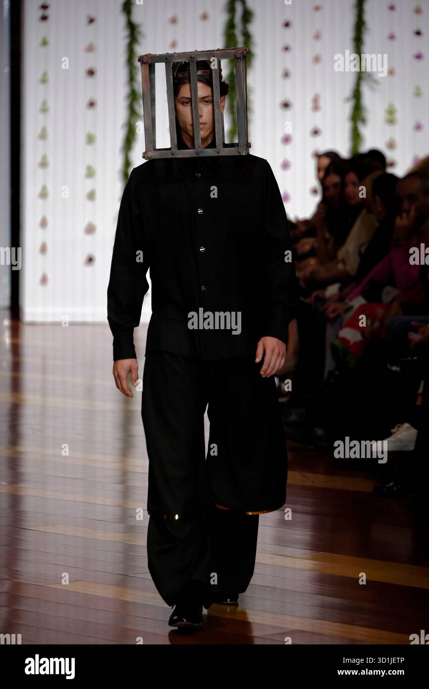 Madrid, Spain. 28th Oct, 2025. A model walks the catwalk during the ...