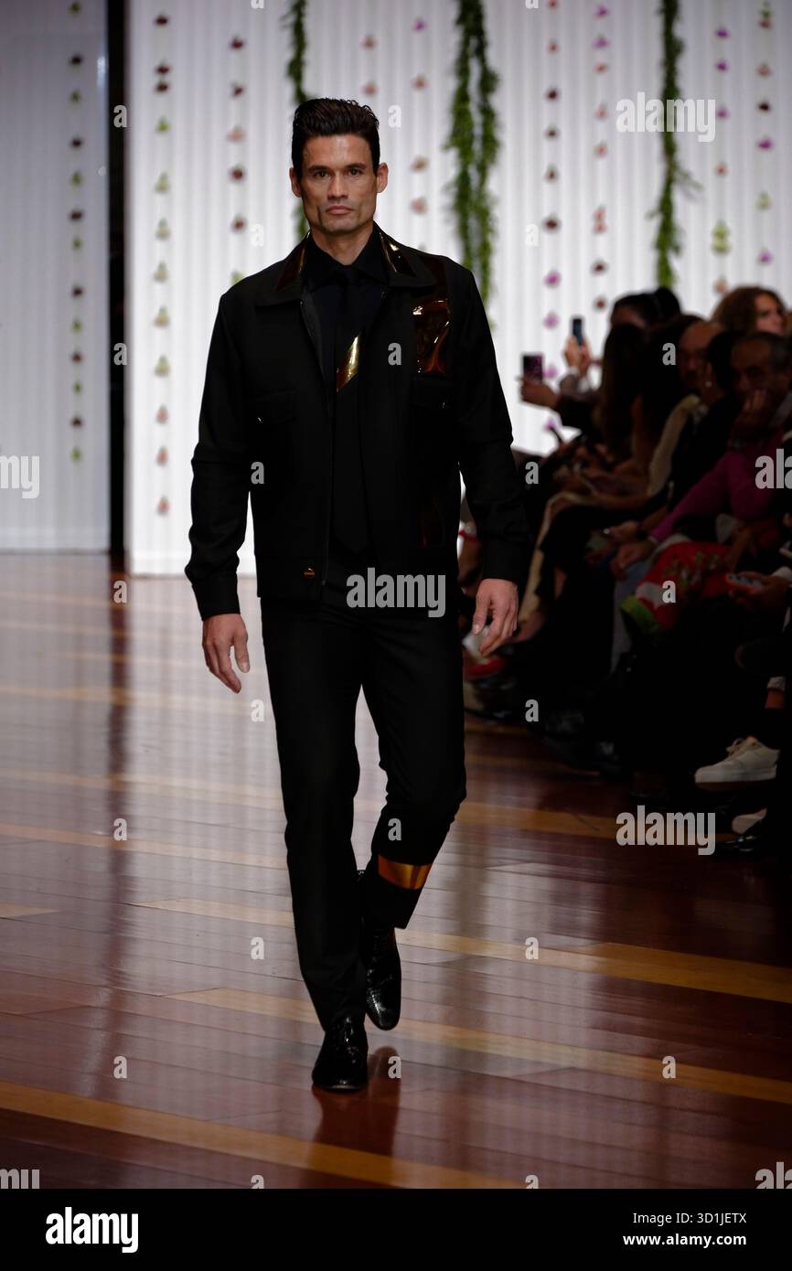 Madrid, Spain. 28th Oct, 2025. A model walks the catwalk during the ...