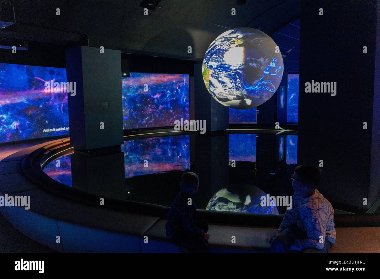 Interactive space museum exhibition with floating Earth globe and ...