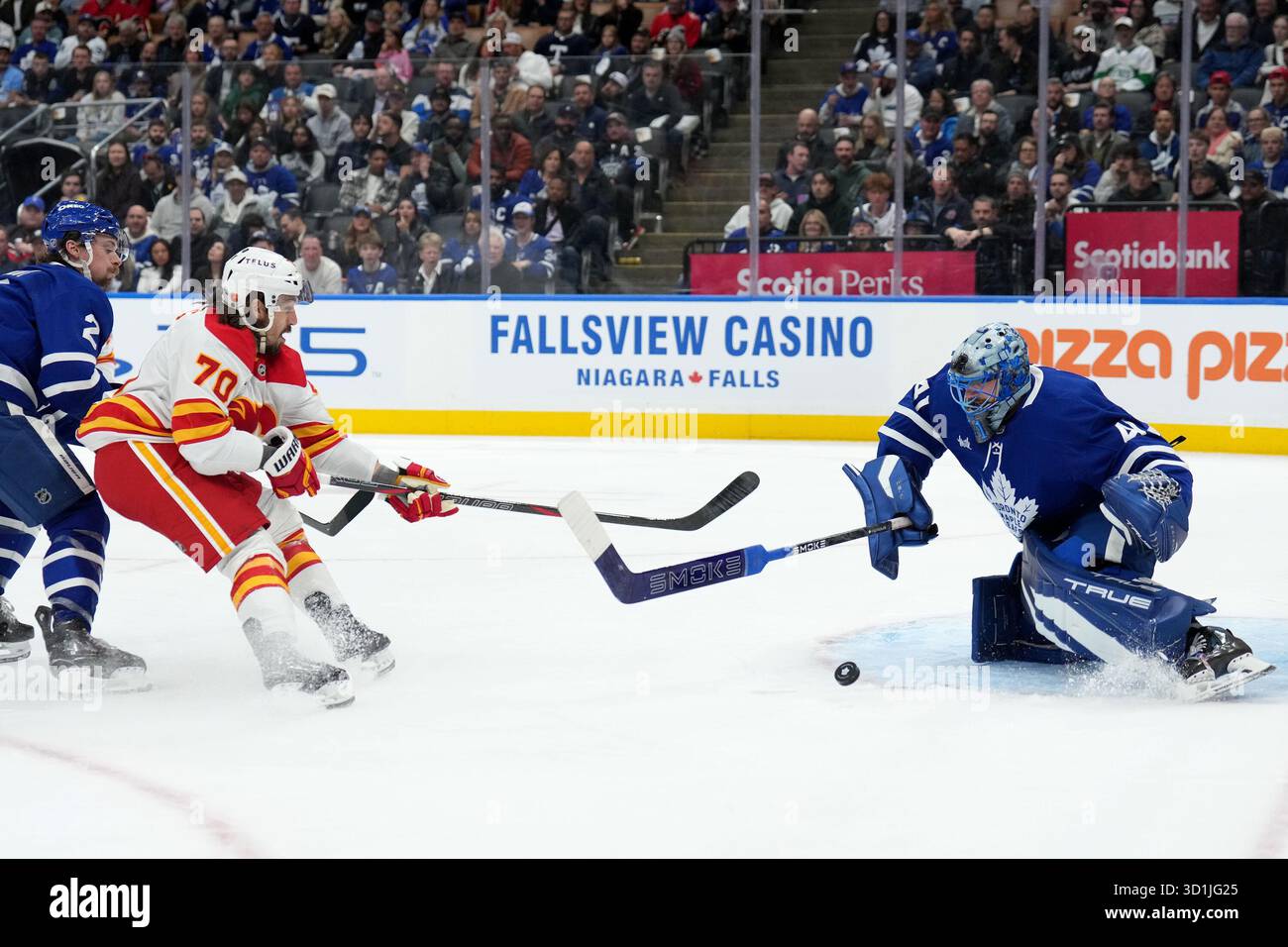 Toronto Maple Leafs goaltender Anthony Stolarz (41) poke checks Calgary ...