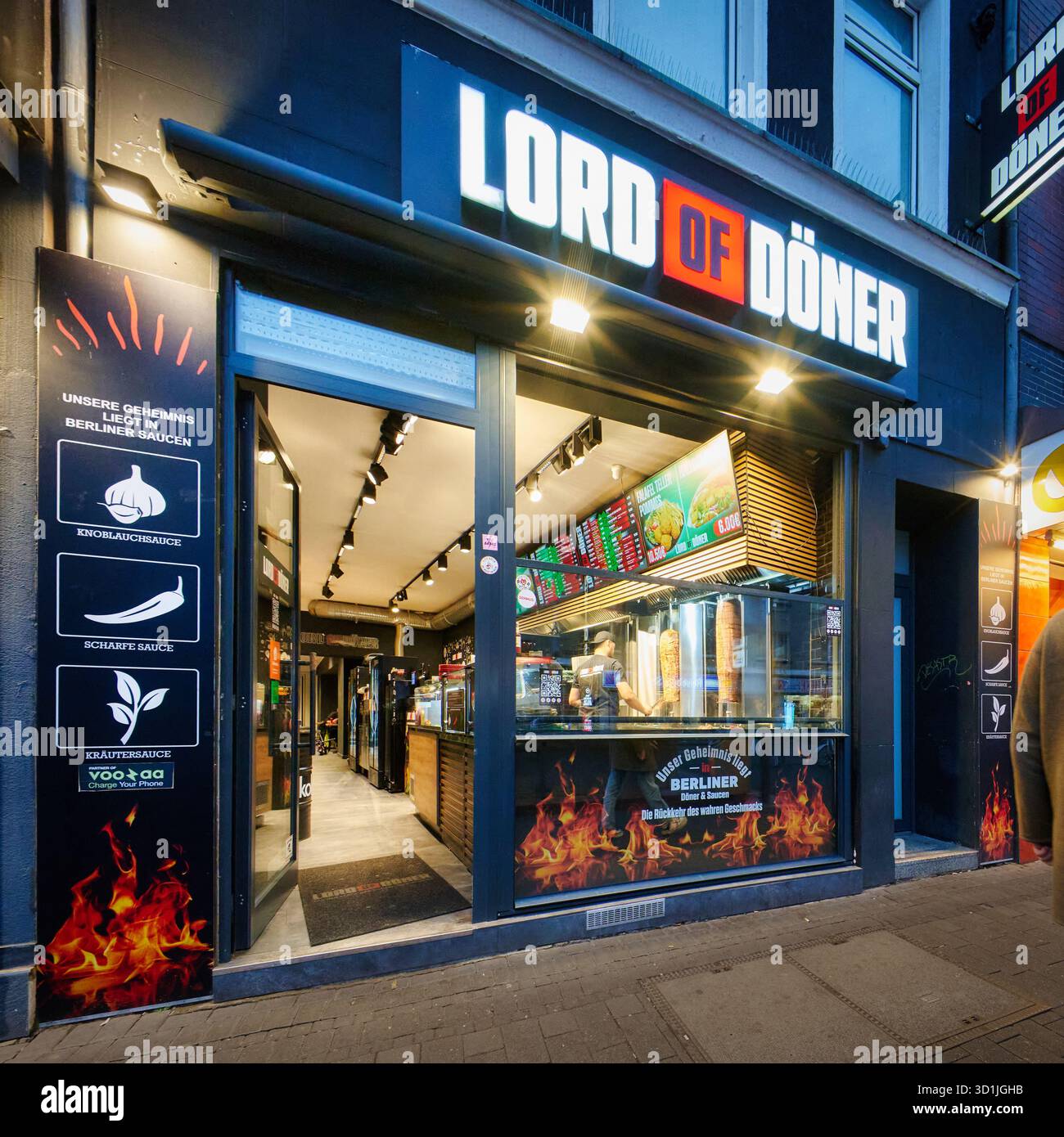 Cologne, Germany October 28 2025: Illuminated Döner Kebab street food ...