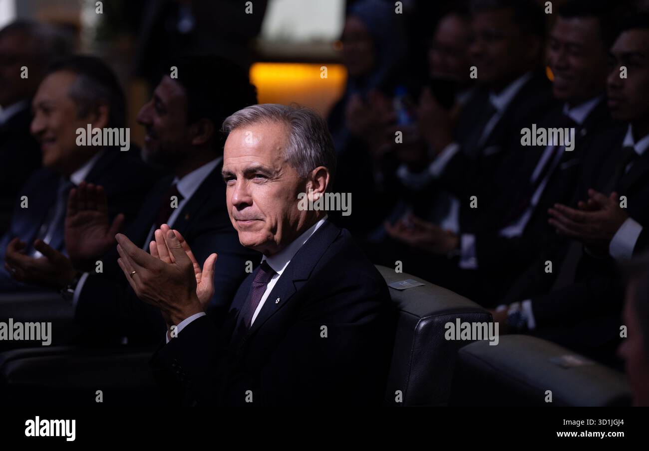 Prime Minister Mark Carney as he watches a signing ceremony at the CAE ...