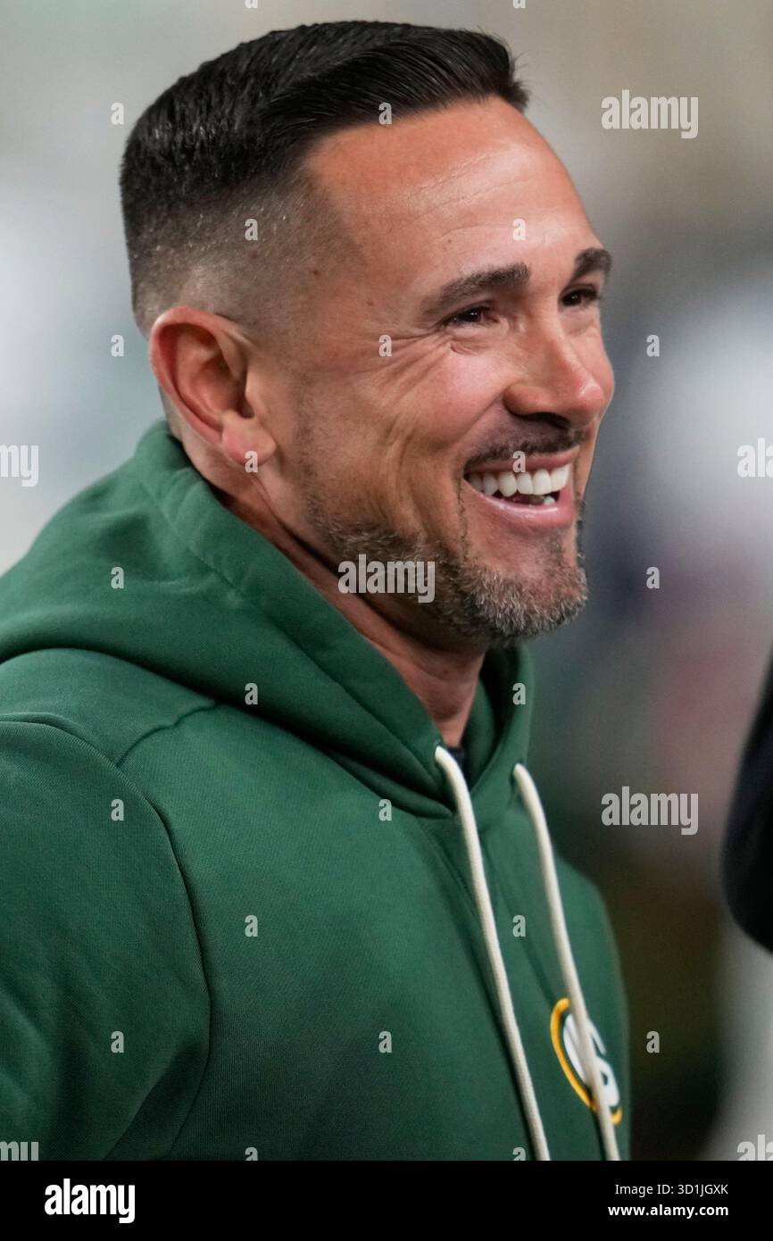 Green Bay Packers head coach Matt LaFleur laughs before an NFL football ...