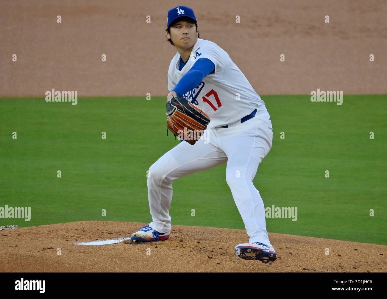 Los Angeles Dodgers starting pitcher Shohei Ohtani (17) throws in the ...