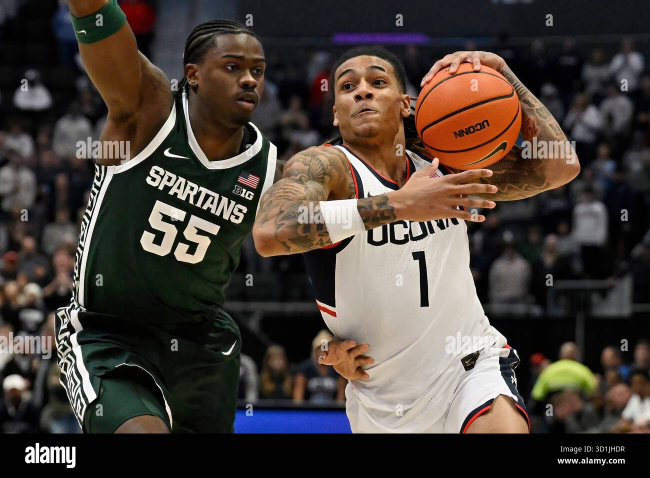 UConn guard Solo Ball (1) drives to the basket as Michigan State ...