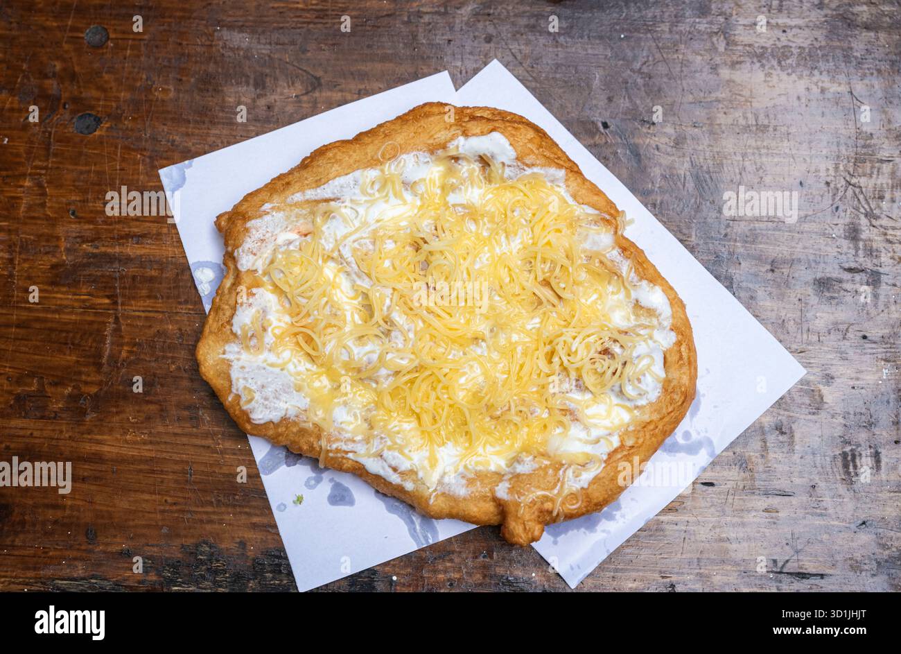 Lángos is a traditional Hungarian fried flatbread made from a leavened ...