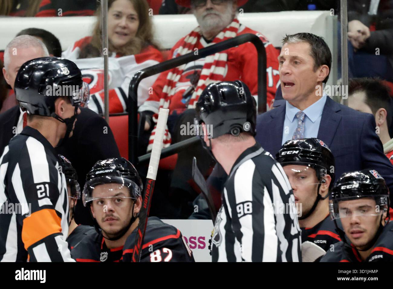 Carolina Hurricanes head coach Rod Brind'Amour, right, discusses a call with the officials ...