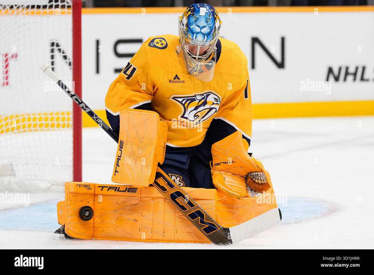 Nashville Predators goaltender Juuse Saros (74) deflects a shot on goal ...