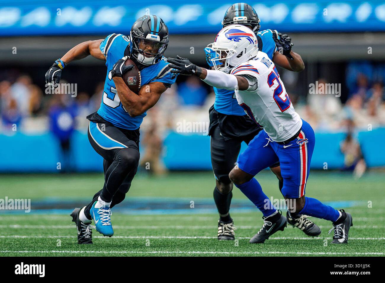 Carolina Panthers running back Chuba Hubbard (30) runs into the tackle ...