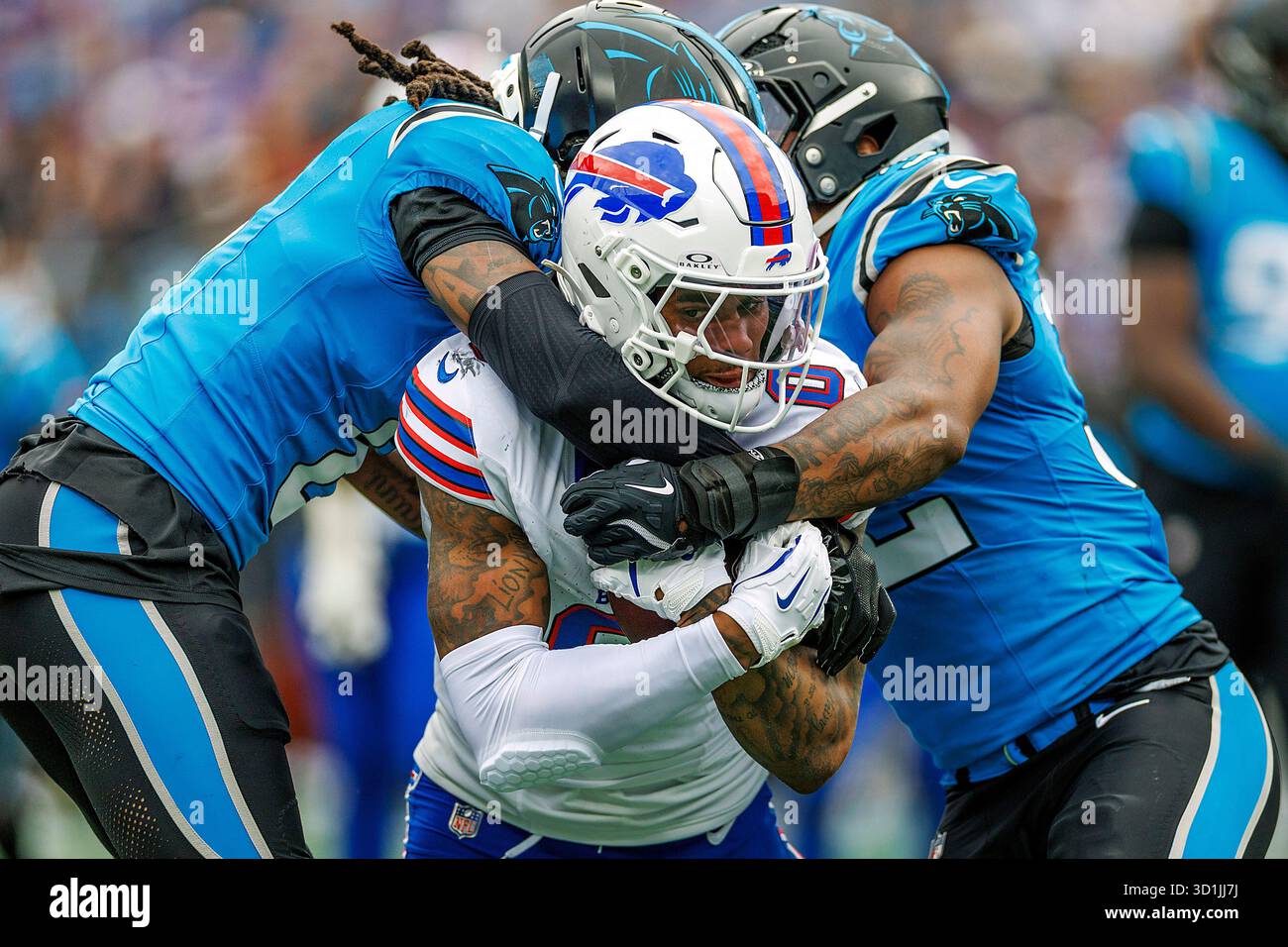 Buffalo Bills wide receiver Keon Coleman, center, is tackled by ...