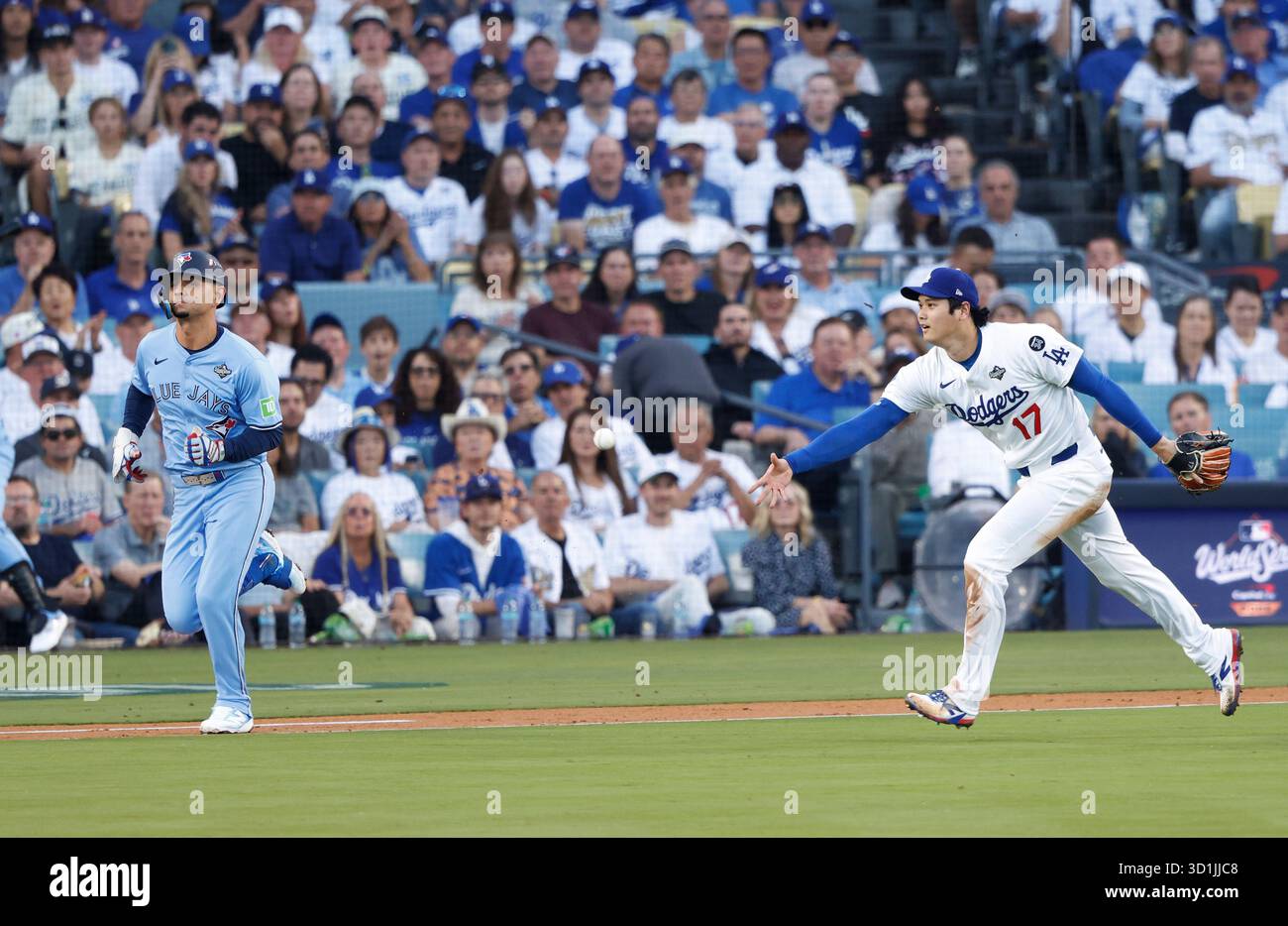 Los Angeles Dodgers Shohei Ohtani (17) throws to first baseman Freddie ...