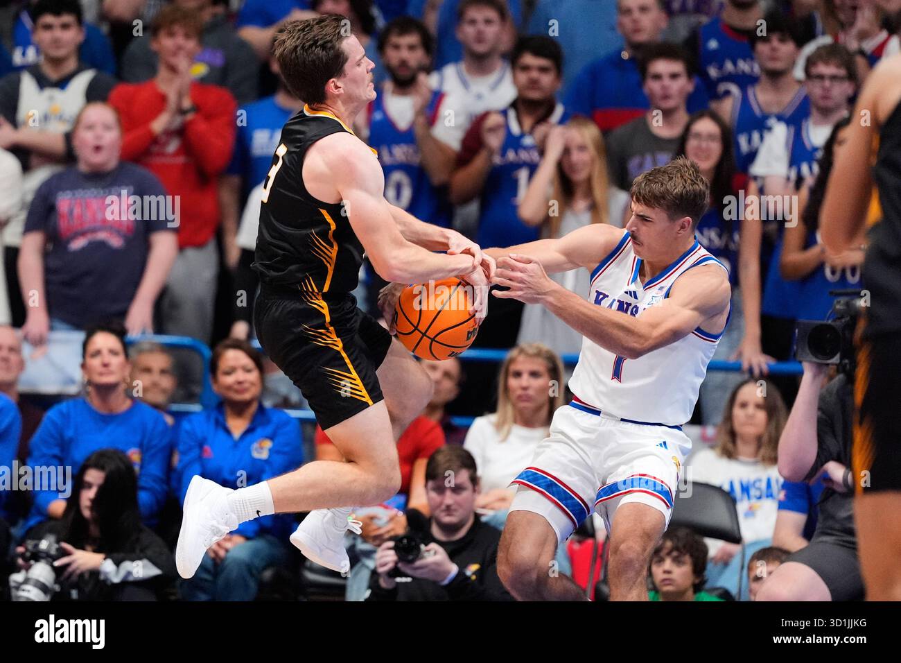 Fort Hays State guard Lucas Hammeke (3) and Kansas guard Jayden Dawson ...