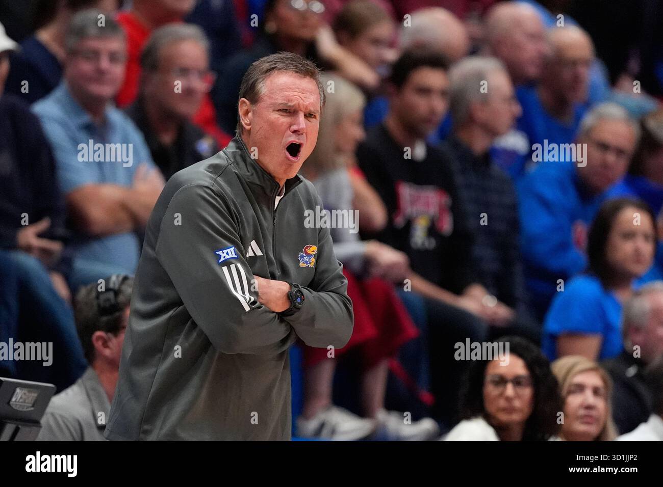 Kansas head coach Bill Self talks to his players during the first half ...