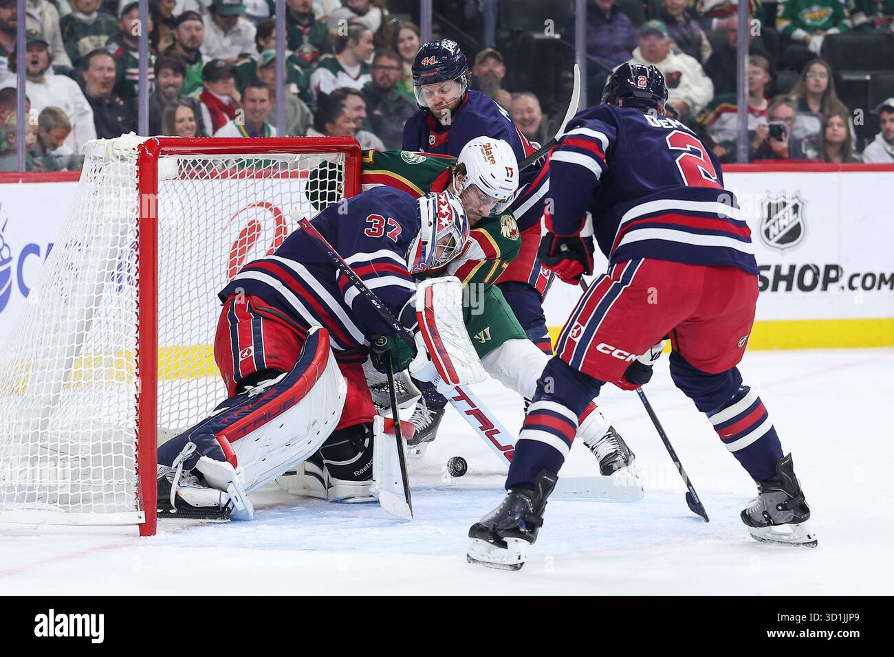 Winnipeg Jets goaltender Connor Hellebuyck makes a save against ...