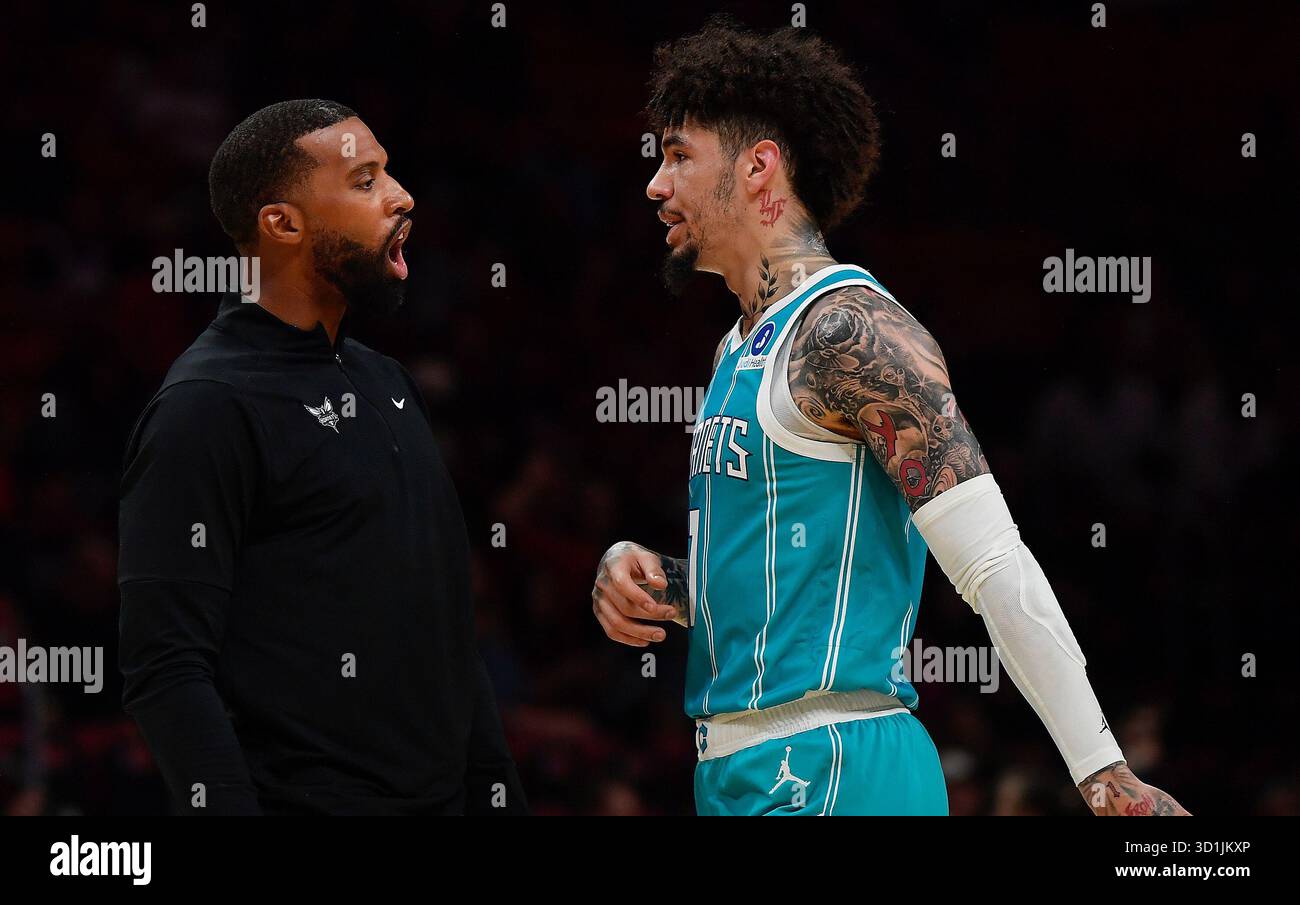 Charlotte Hornets coach Charles Lee talks to LaMelo Ball during the ...