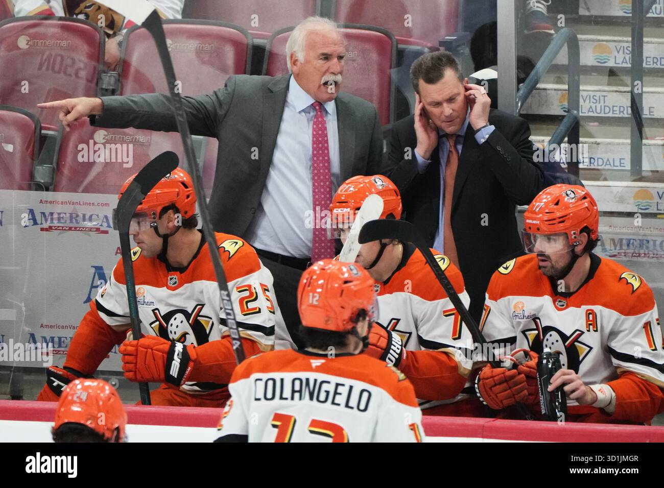 Anaheim Ducks head coach Joel Quenneville, left, calls a play during ...