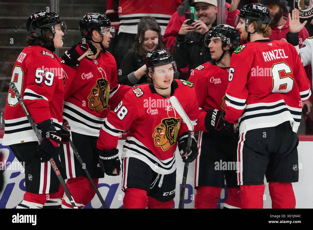 Chicago Blackhawks center Connor Bedard (98), center, celebrates his ...