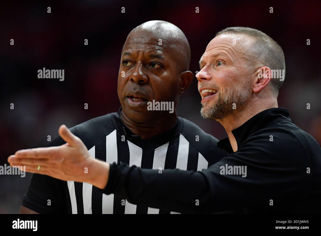 Louisville head coach Pat Kelsey argues with referee Clarence Armstrong ...