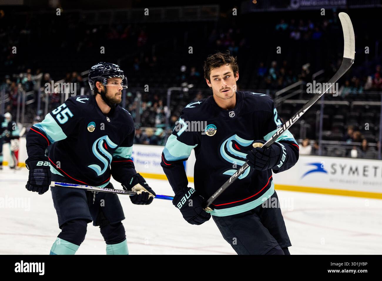 Seattle Kraken left wing Mason Marchment, right, and defenseman Ryan ...