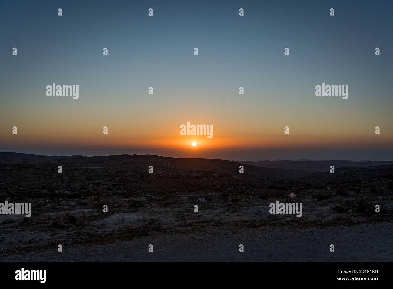The sun is seen rising over the hills of the West Bank Stock Photo - Alamy