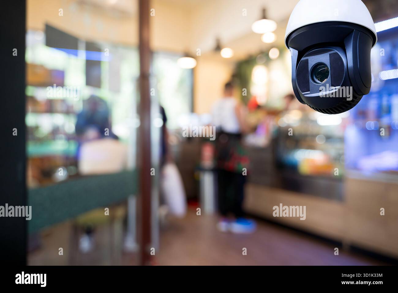Close-up of security CCTV camera installed inside coffee shop with ...