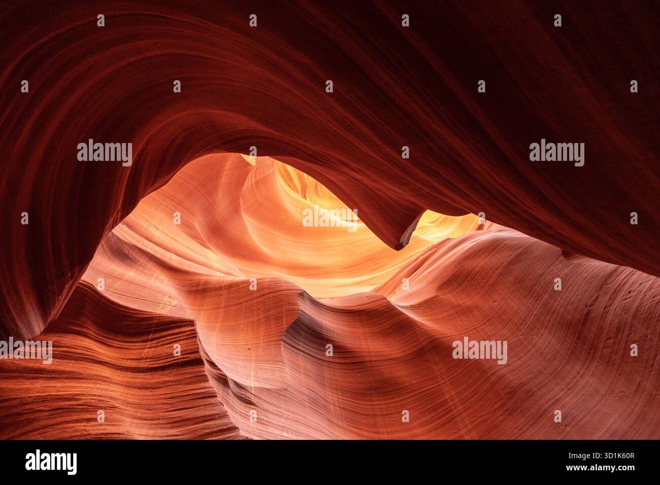 Warm Light Glowing on Wavy Slot Canyon Sandstone Walls Stock Photo - Alamy