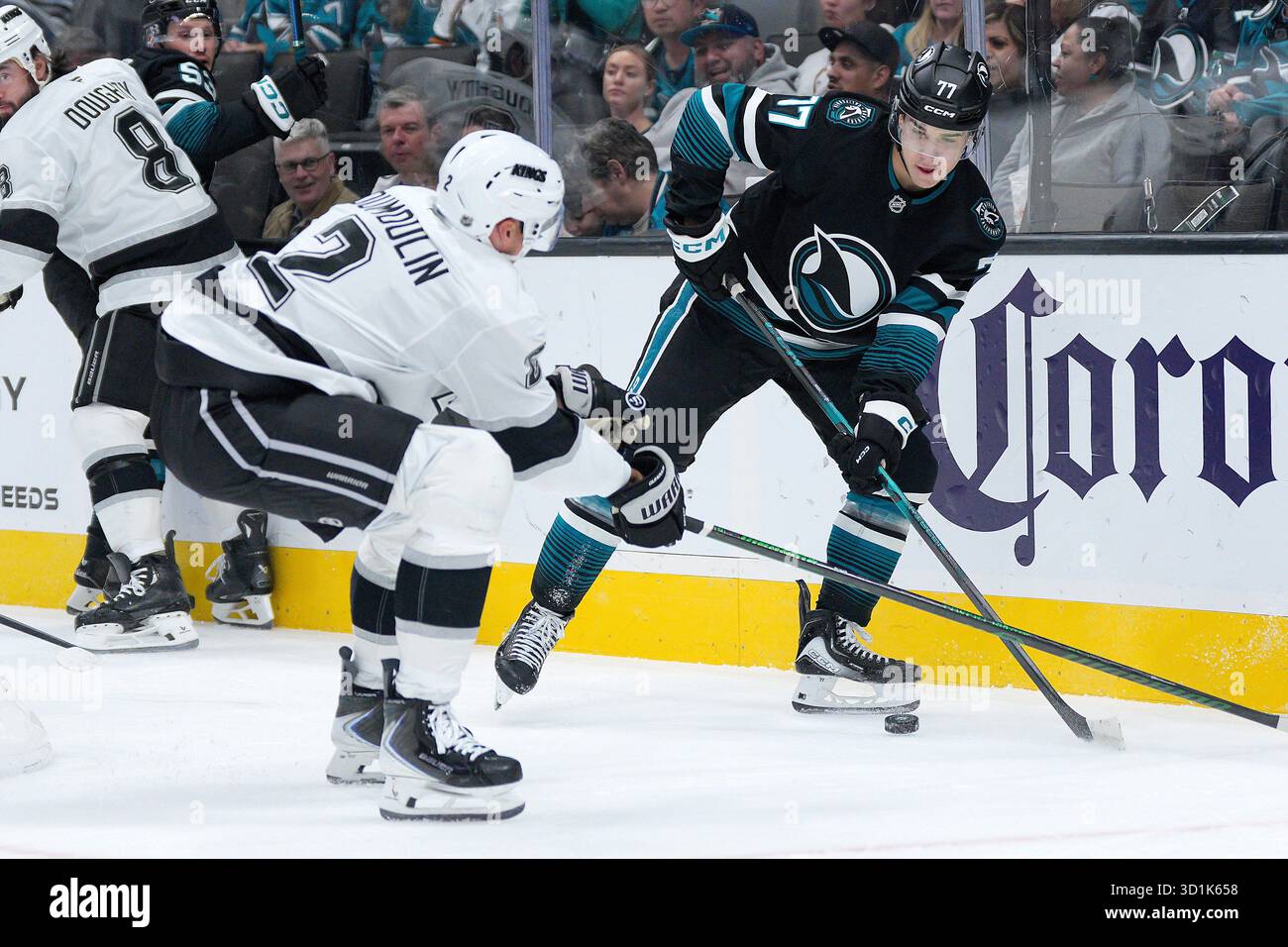 San Jose Sharks center Michael Misa (77) battles for the puck against ...