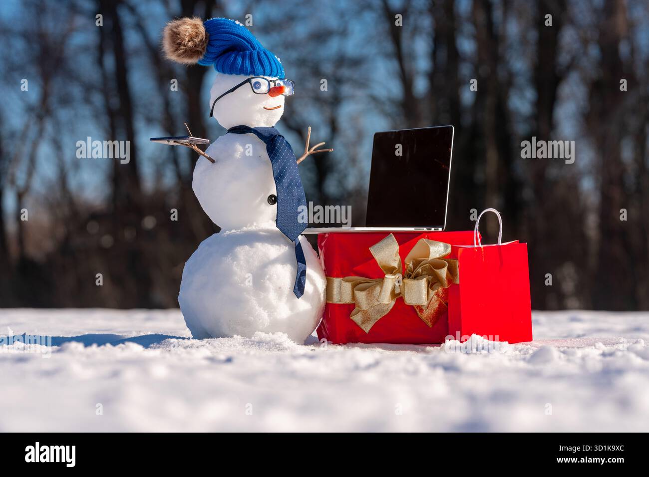 Snowman making a phone call and using laptop. Funny snowman talking on ...