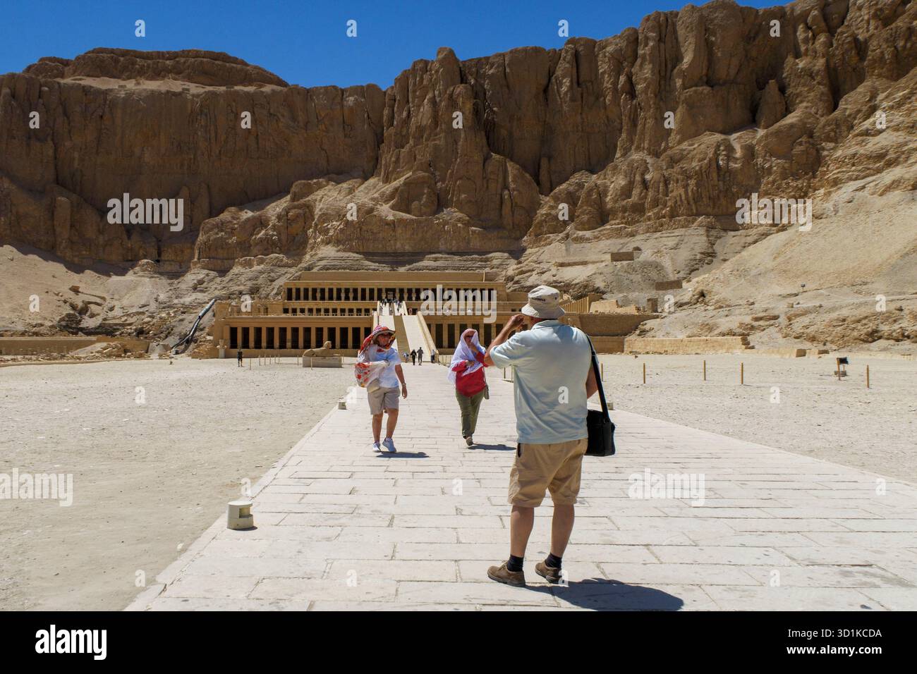 Tourists visiting the ancient Mortuary Temple of Hatshepsut with ...