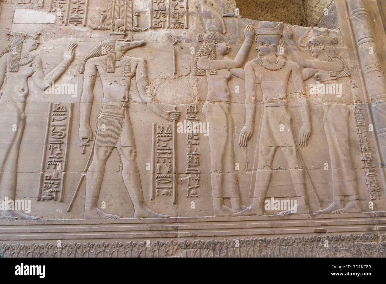 Ancient Egyptian wall relief depicting Sobek and figures with ...
