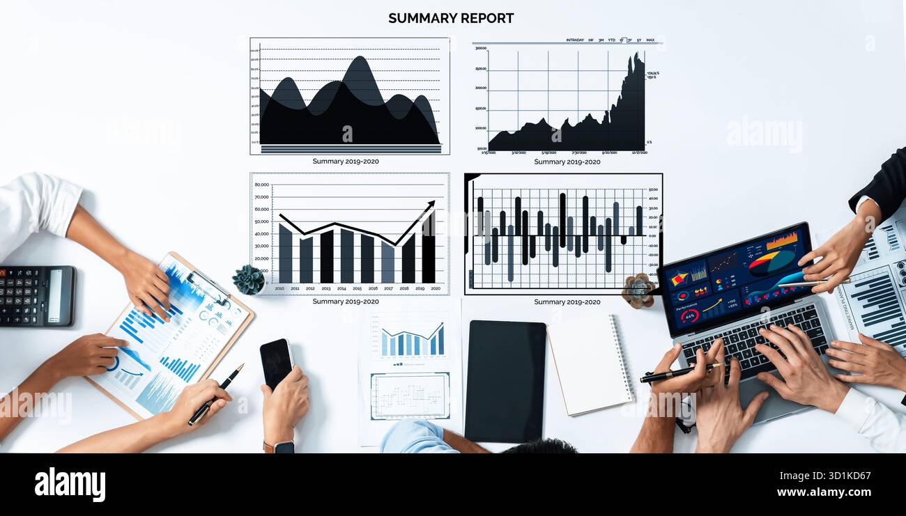 A business team collaborating in a modern office setting, analyzing a ...