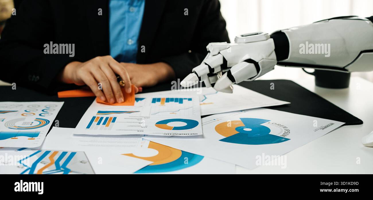 A professional collaborates with a robotic arm, examining financial ...