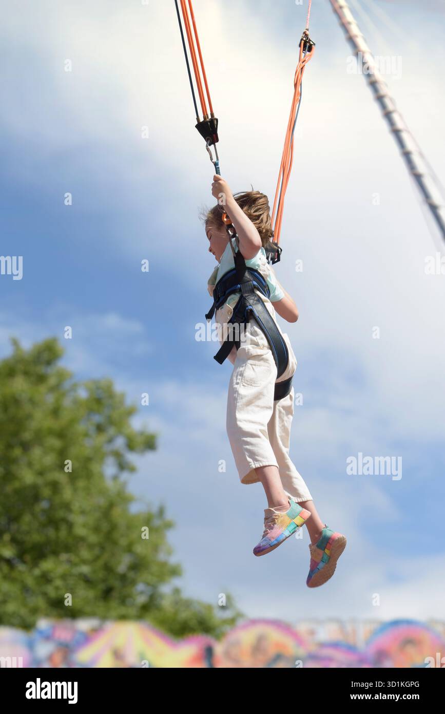 An attraction in a park for children on jumping rubber bands Stock ...