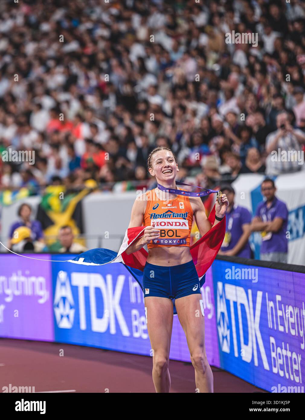 Femke Bol celebrating her medal with her country's flag at the 2025 ...