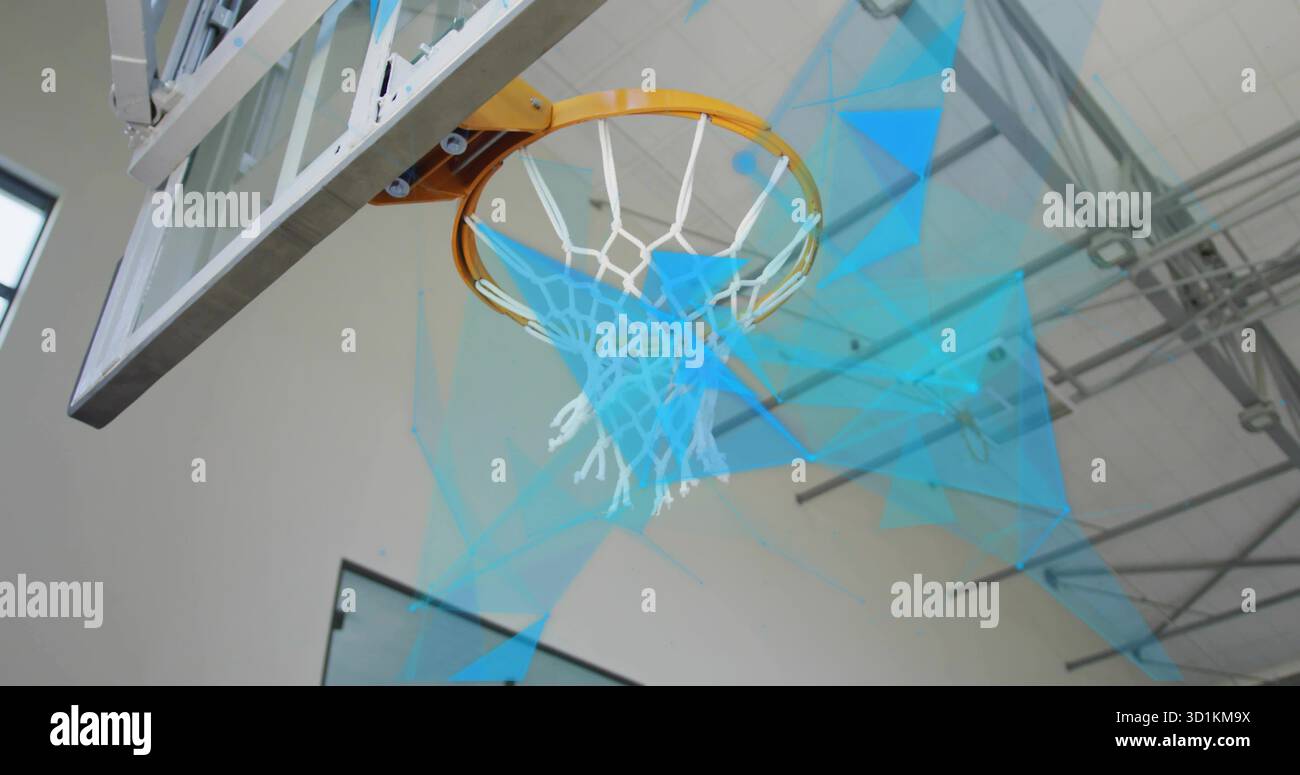 Capturing basketball hoop under gym truss ceiling, with clear backboard ...