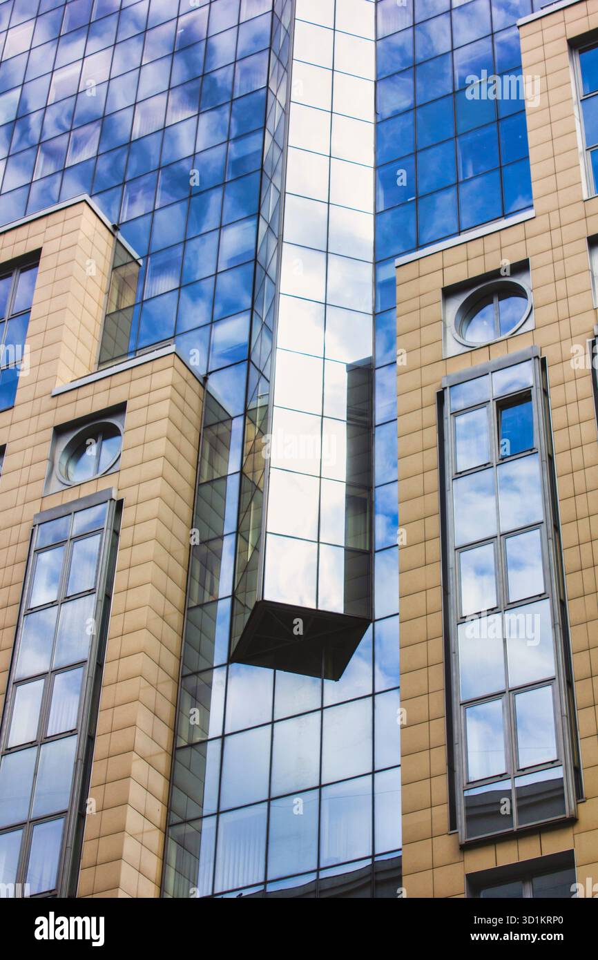 The image shows a modern architectural structure featuring a facade ...