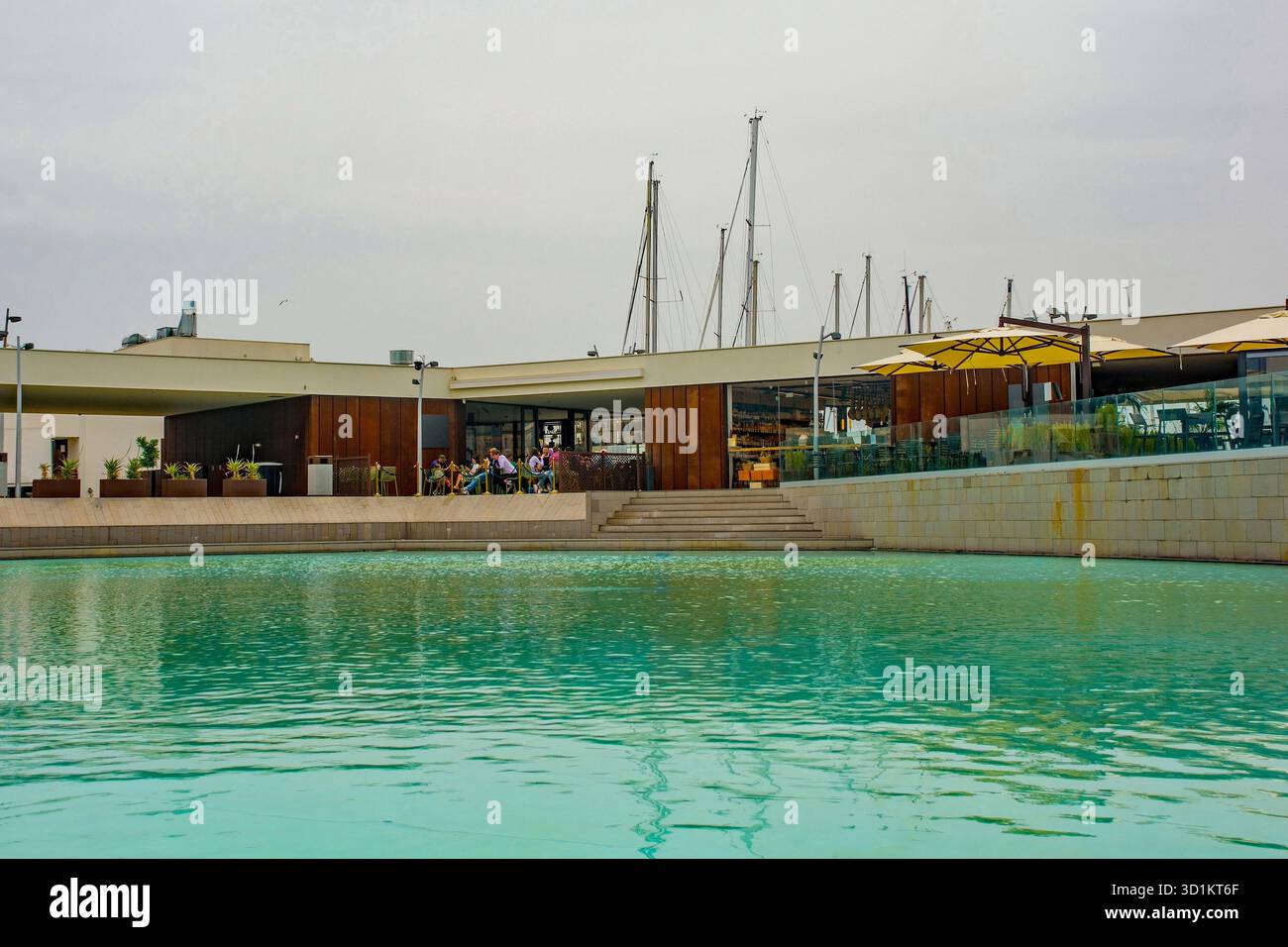 Contemporary promenade buildings with bars at Molo Trapezoidale in ...