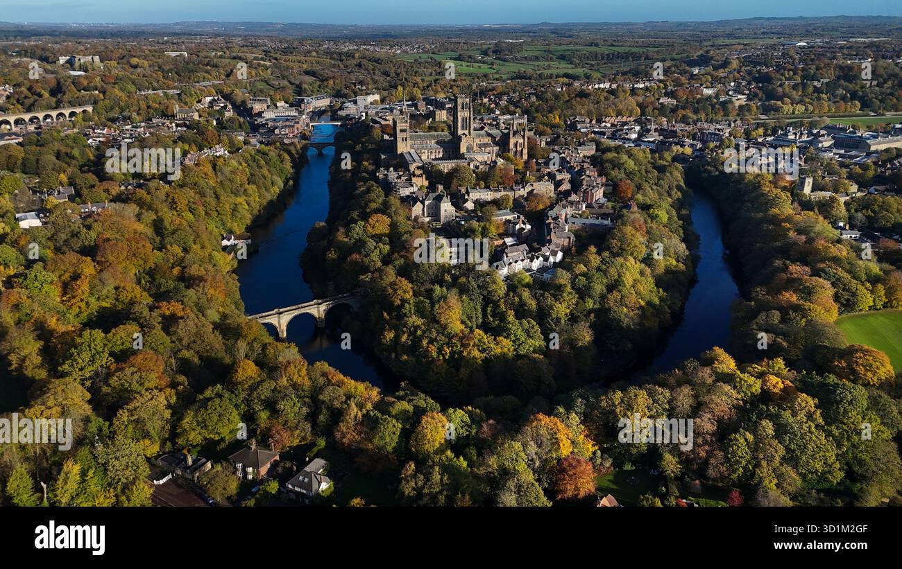 Autumn colours surround Durham Cathedral as the River Wear flows past ...