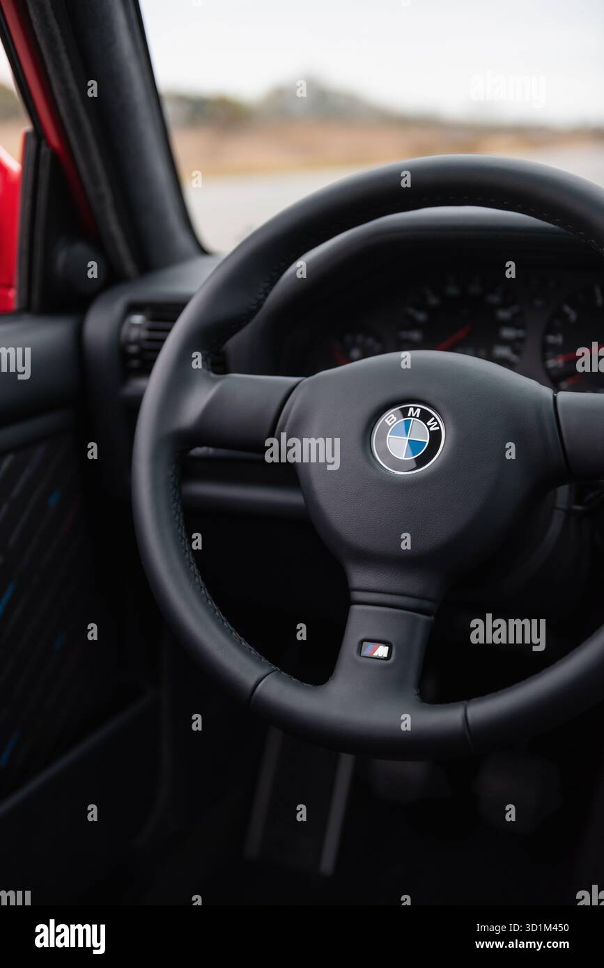 Steering wheel of 1980s BMW - close-up. Classic BMW M3 interior with ...