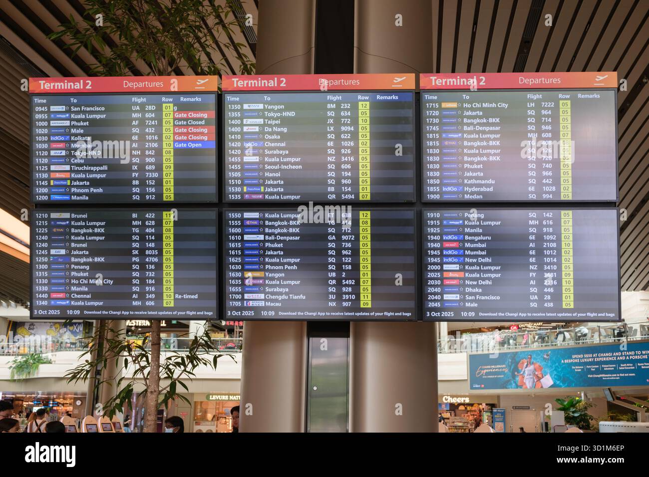 Changi Airport Terminal 2 showcases a modern departure board with ...