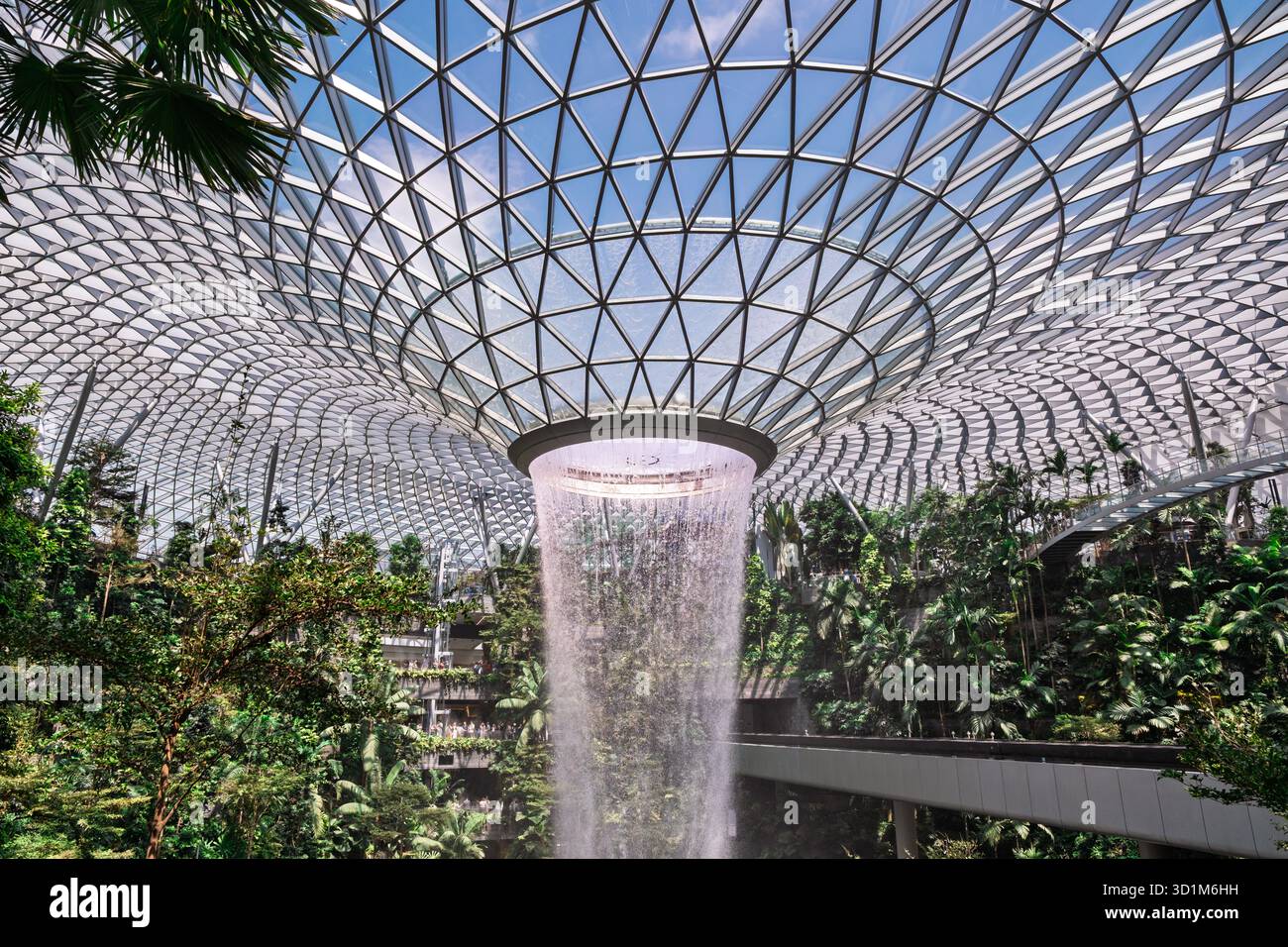 Jewel Changi Airport features a magnificent indoor waterfall surrounded ...