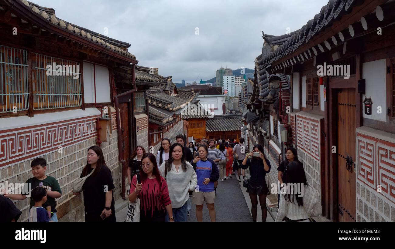 SEOUL, SOUTH KOREA - OCTOBER 11, 2025 - Tourists exploring an old ...
