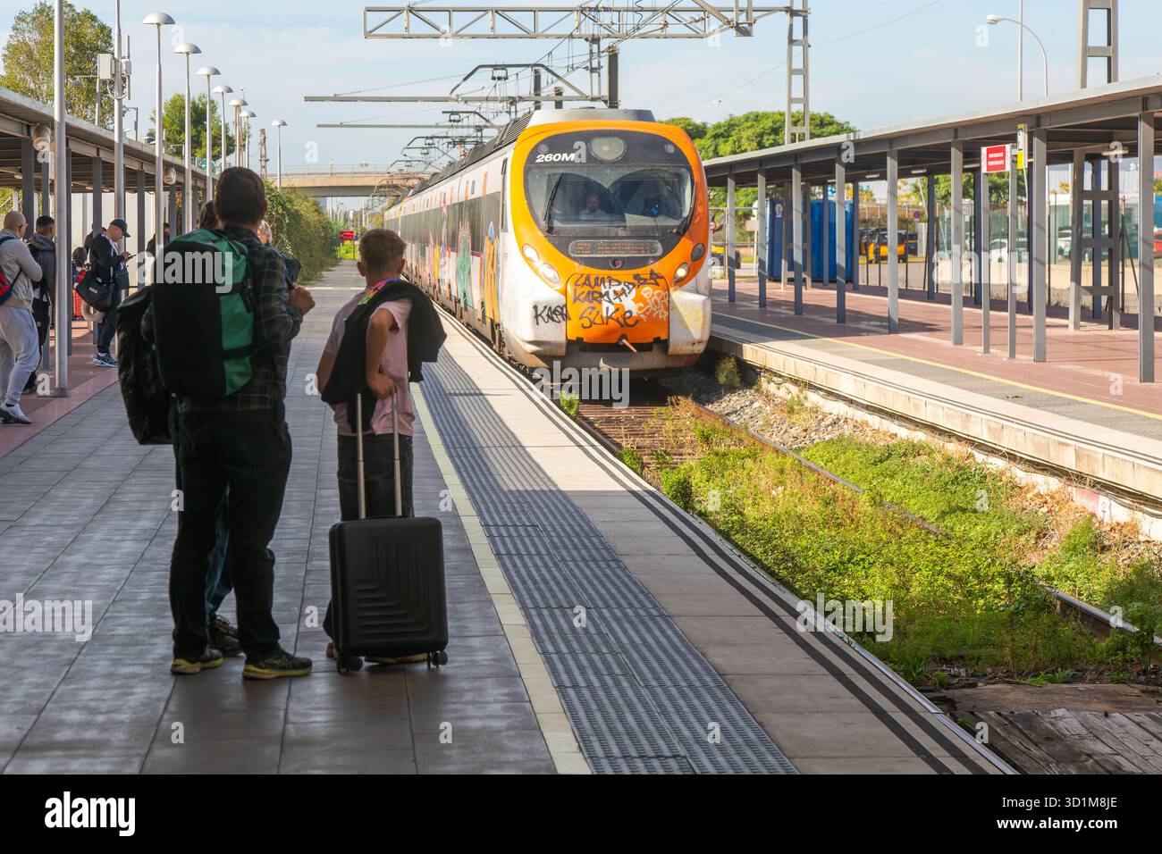 Renfe Civia commuter train at platform of Airport railway station ...
