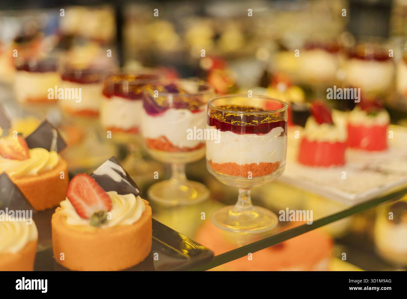 A tempting array of desserts showcases vibrant cakes and creamy layers ...