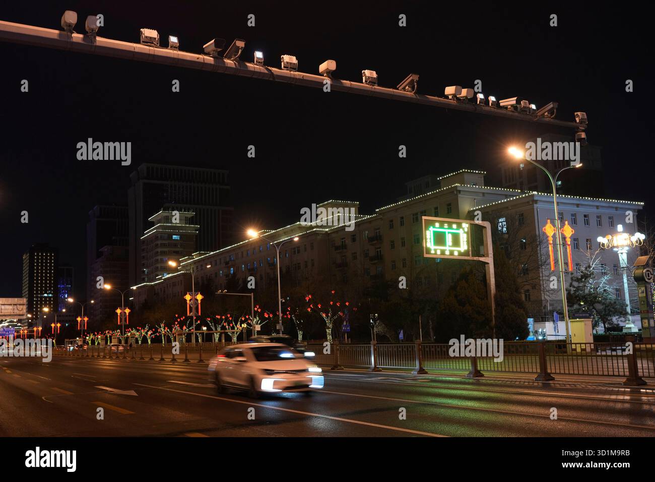 CCTV cameras are lined up on a pole along a road in Beijing, Tuesday ...