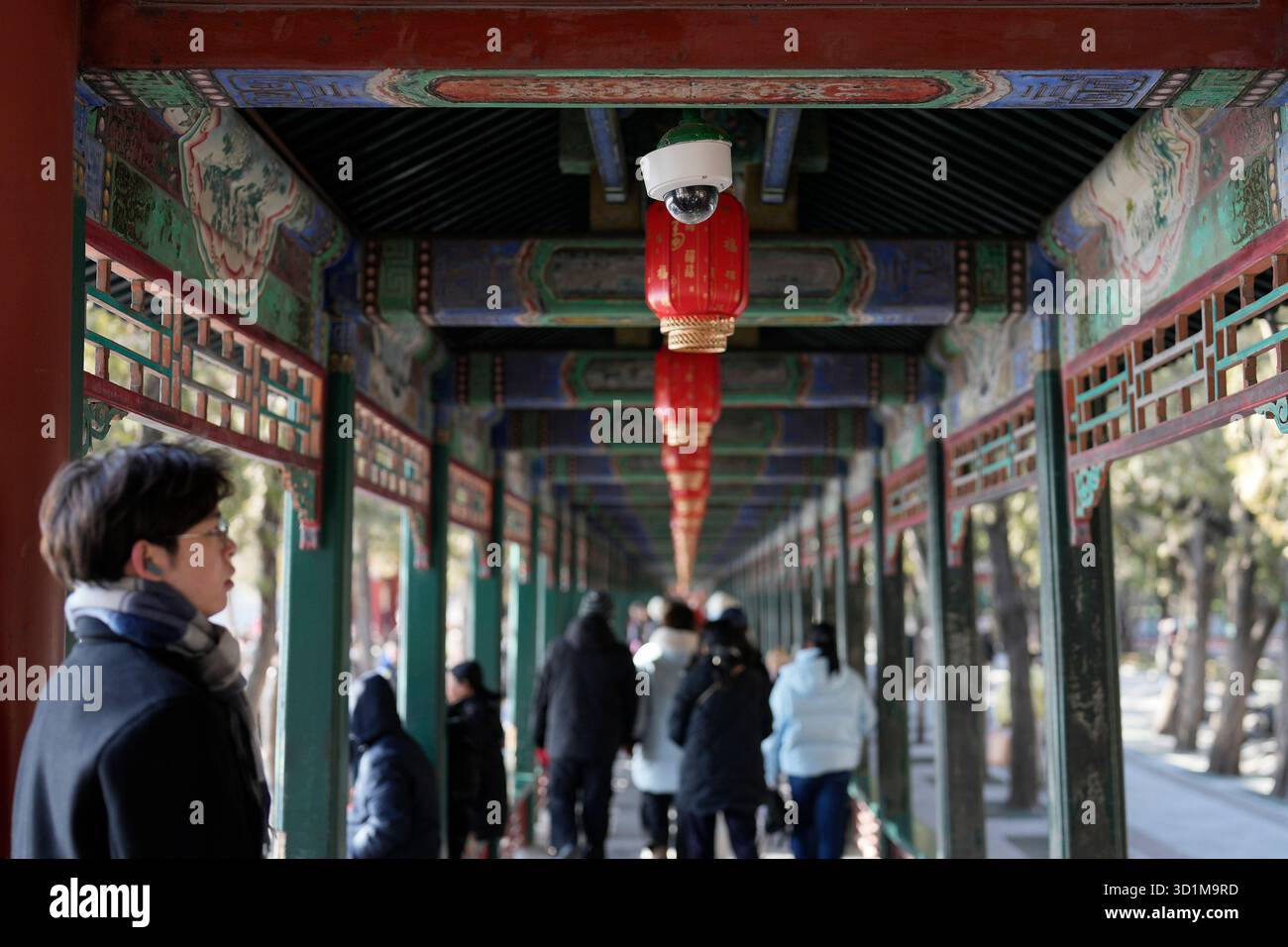 A CCTV camera is positioned beside lanterns at the Summer Palace in ...